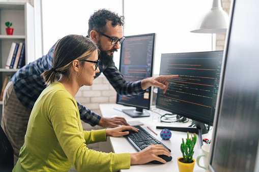 Software Programmers Analyzing Html Code And Database Brainstorming Script Ideas To Develop New