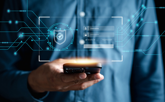 Businessman Using Smartphone To Access Scanner Fingerprint Biometric Data By Input Password