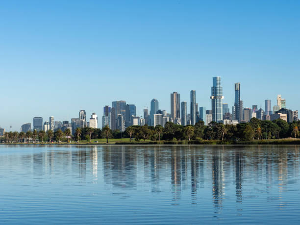 Free Stock Photo of A body of water with trees and a city skyline in ...