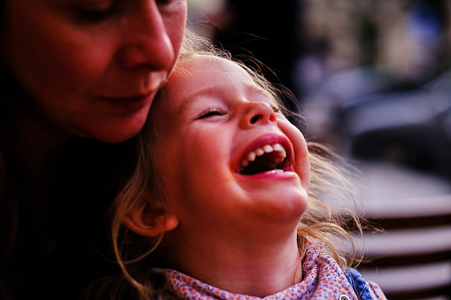 Small Girl Laughing In Her Mums Arms Stock Photo - Download Image Now ... Small Girl Laughing In Her Mums Arms Stock Photo - Download Image Now ...