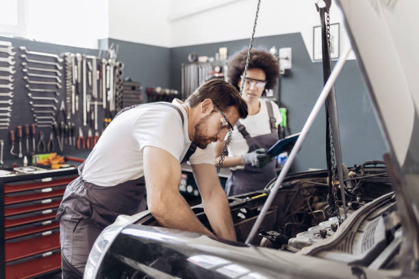 Free Stock Photo of Auto mechanic checking and repairing car at ...