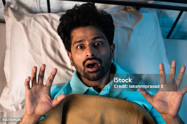 Young Man Suddenly Wakes Up During Night While Sleeping On Bed Concept ... Young Man Suddenly Wakes Up During Night While Sleeping On Bed Concept ...