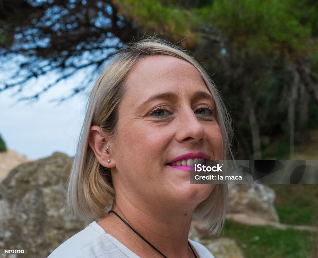 Portrait Middleaged Woman Blonde Hair And Pink Lips Concept Enjoy And