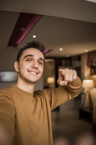 Handsome Caucasian Man Taking Self Portrait Indoors At Home In His