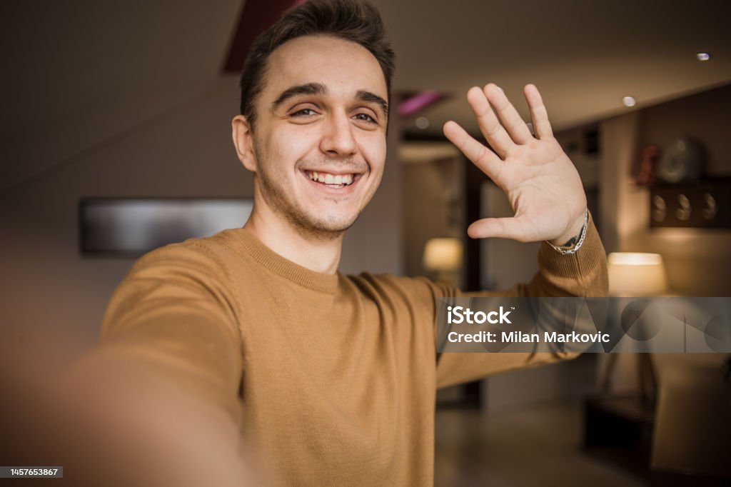 Handsome Caucasian Man Taking Self Portrait Indoors At Home In His