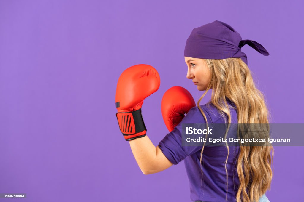 Side View Of Feminist Woman Wearing Boxing Gloves With Copy Space Stock