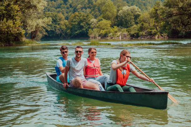 Free Stock Photo of Group of People Canoeing Down River | Download Free ...