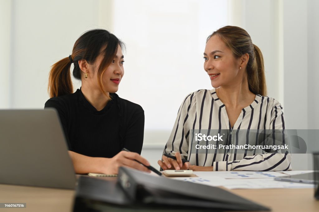 Two Professionals Business Women Discussing Project Developing