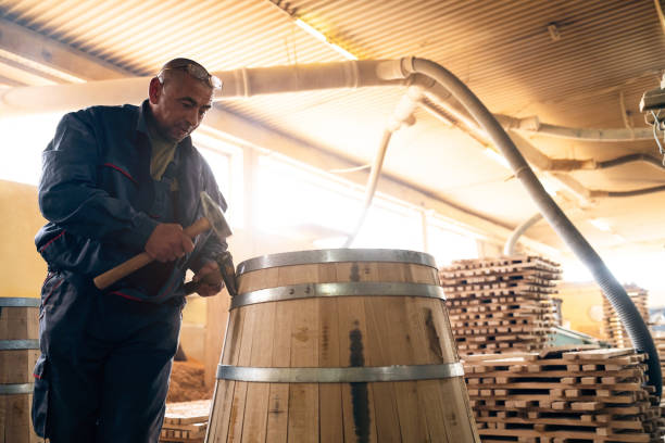 Free Stock Photo of Man Standing Next to Wooden Barrel Holding ...
