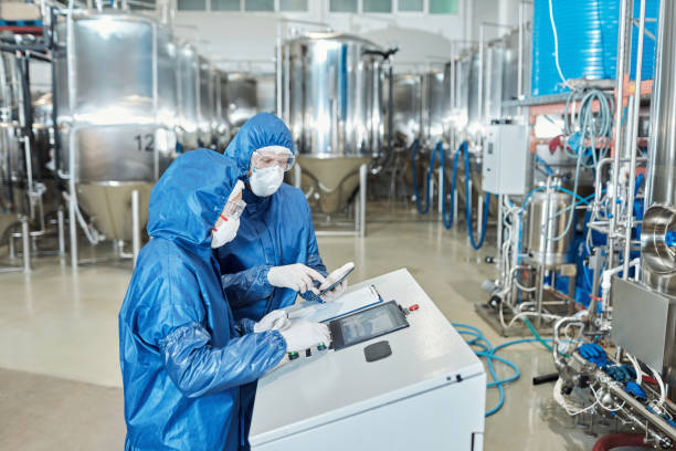 Free Stock Photo of Workers producing surgical masks in modern factory ...