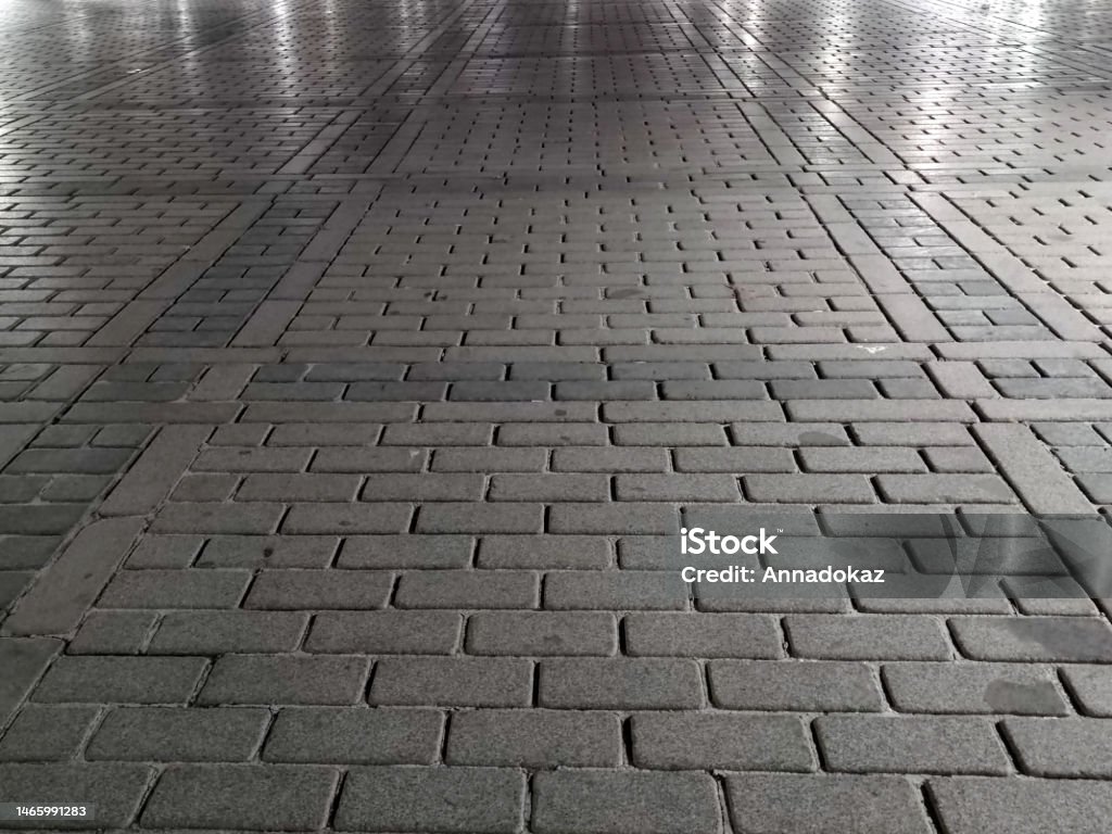 Reflection Of Street Lights In Paving Stones Texture For Background