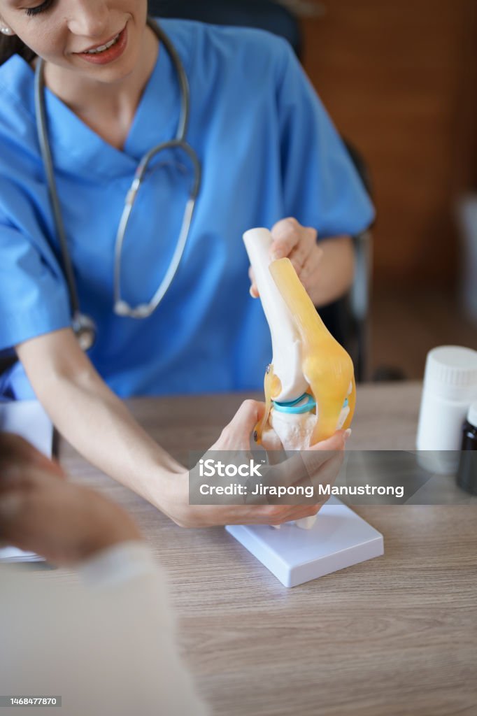 Portrait Of A Female Doctor Talking To An Elderly Patient About