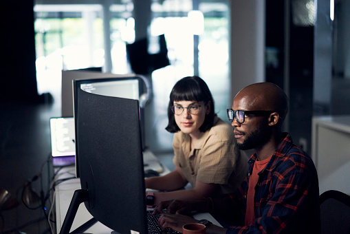 Developers Coding And Programming At Night On Computer In Software Or