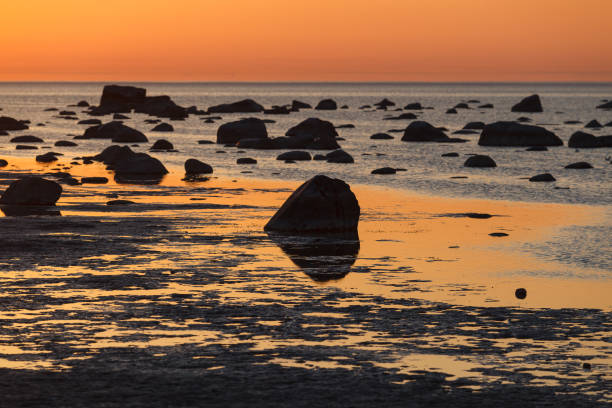 Free Stock Photo of Sunset Over Water With Rocks in Foreground ...