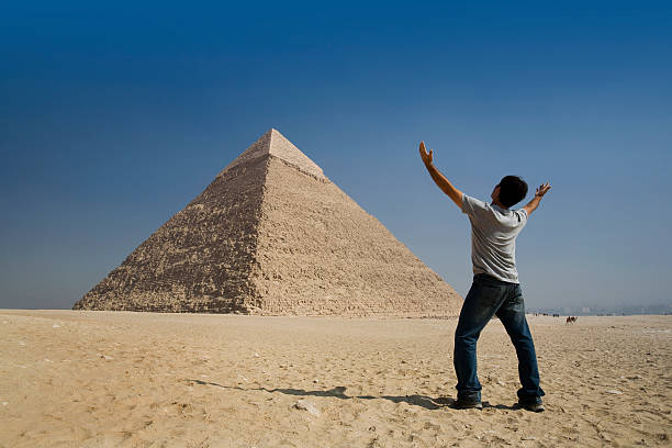 Free Stock Photo of Man Standing in Front of a Very Tall Pyramid ...
