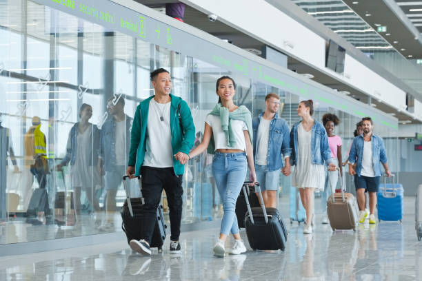 Free Stock Photo of Group of People Walking Through an Airport ...