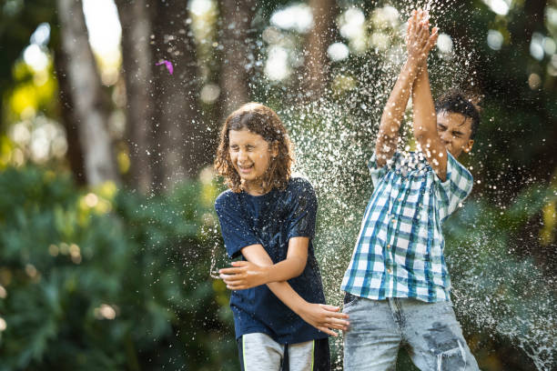 Free Stock Photo of Two children playing with water | Download Free ...