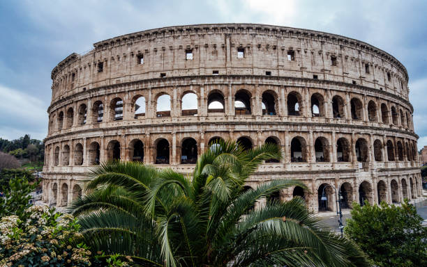 Free Stock Photo of Ancient Colosseum surrounded by lush trees in Rome ...