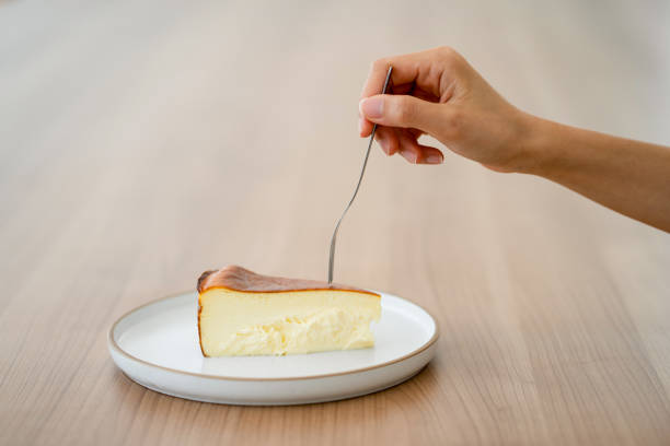 Free Stock Photo of A hand holding a fork to a piece of cake | Download ...