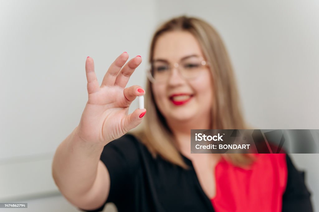 Smiling Proctologist Doctor Showing Rectal Suppository Closeup Stock