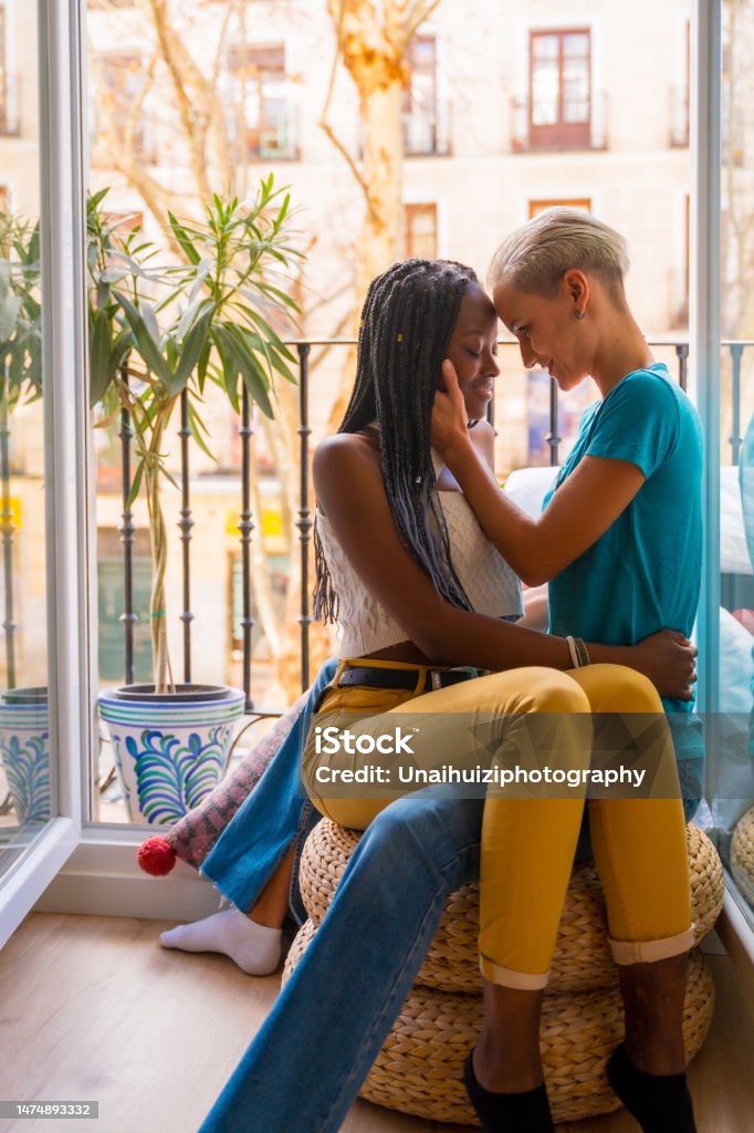 Beautiful Lesbian Couple In Romantic Pose Hugging On The Balcony At Home Lgbt Concept Stock 5343