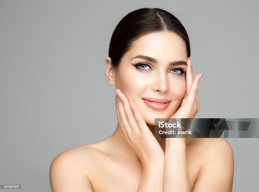 Face Skin Care Beauty Woman With Full Lips Natural Makeup Over Gray