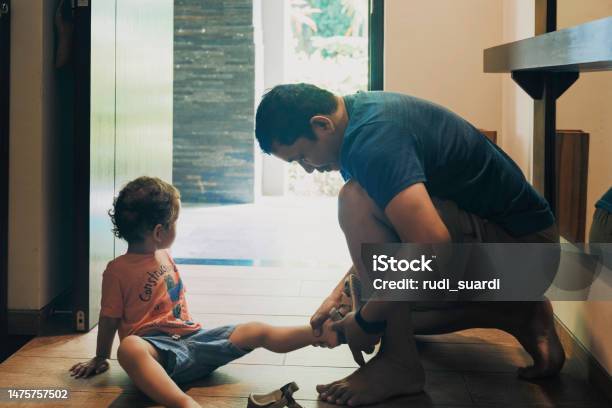 Father Helping His Son Put His Shoes On Stock Photo - Download Image ... Father Helping His Son Put His Shoes On Stock Photo - Download Image ...