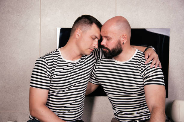 40 Mature Older Senior Gay Male Couple Smiling And Affectionate Stock