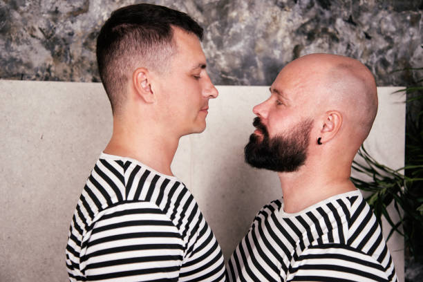 40 Mature Older Senior Gay Male Couple Smiling And Affectionate Stock