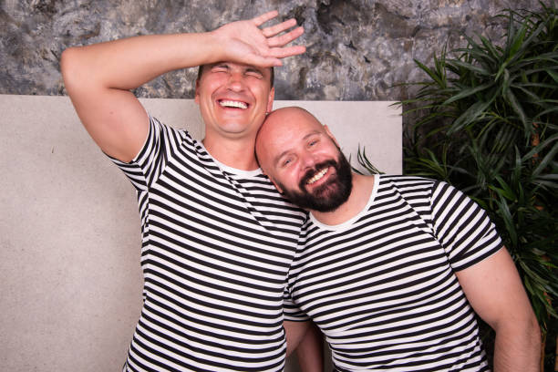 40 Mature Older Senior Gay Male Couple Smiling And Affectionate Stock