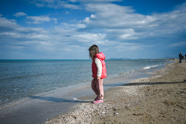 Free Stock Photo of Little Girl Standing on Rocks, Looking at Water ...