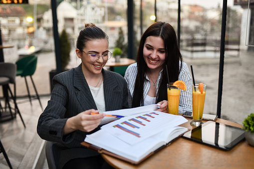 Graphic Charts Analysis By Beautiful Smiling Female Bankers Stock Photo ... Graphic Charts Analysis By Beautiful Smiling Female Bankers Stock Photo ...