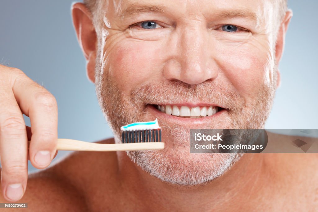 Portrait Toothpaste Or Old Man Brushing Teeth With A Product For