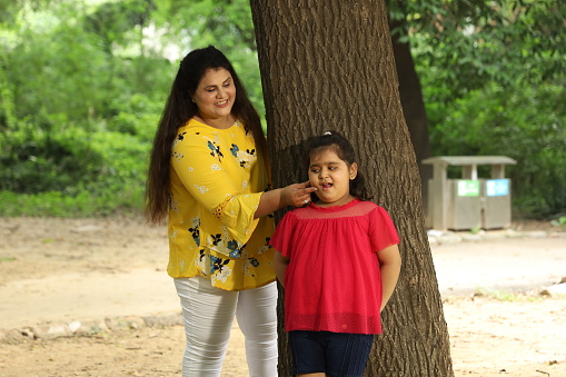 Happy Indian Mother And Daughter Together Playing Hide And Seek In A