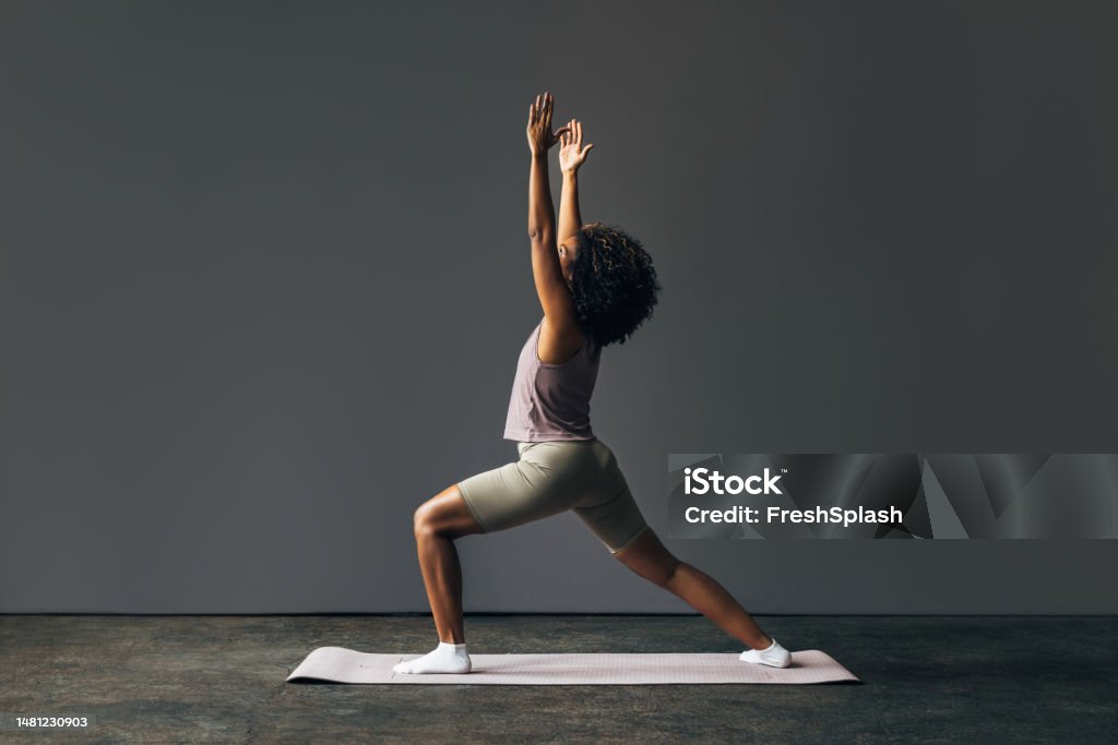 A Beautiful Woman In Sports Clothes Doing Her Daily Workout With Her