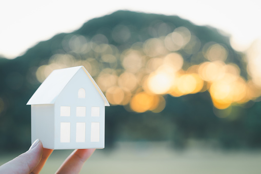 House Model In Home Insurance Broker Agents Hand With Building