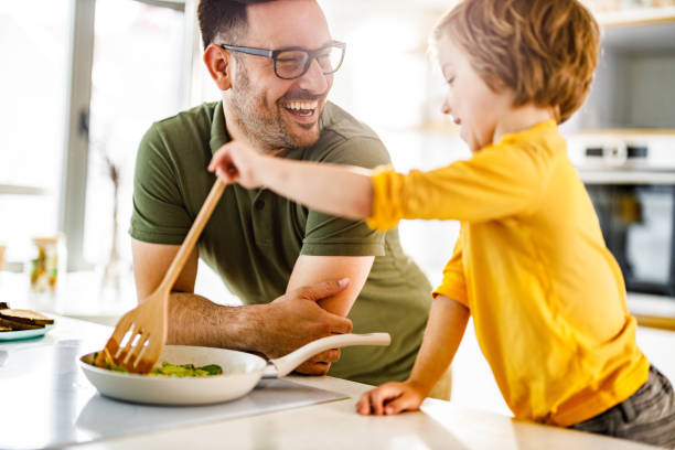 Free Stock Photo of Father and child making breakfast together ...