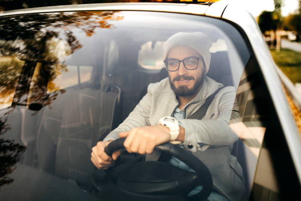 Free Stock Photo of Man Driving Car With City Background | Download ...