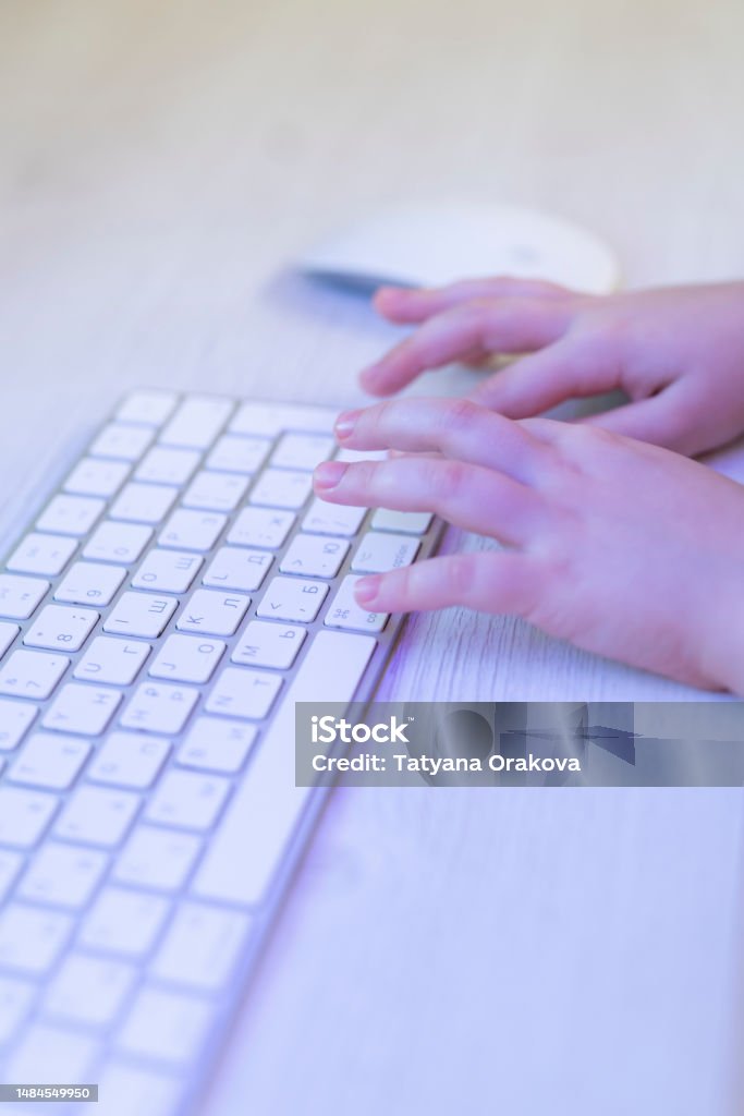 Childrens Hands Are Typing On The Keyboard The Child Plays Computer ... Childrens Hands Are Typing On The Keyboard The Child Plays Computer ...