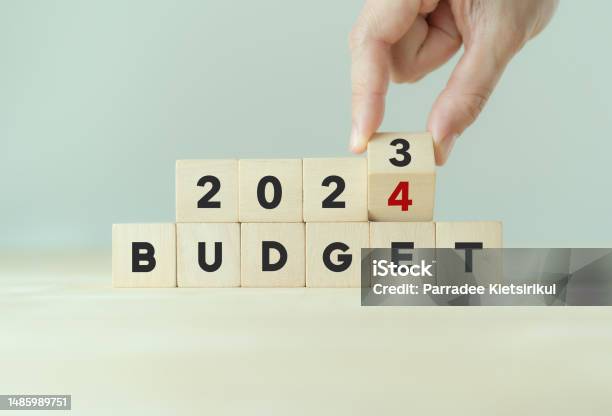 2024 Budget Planning And Allocation Concept Hand Flips Wooden Cube And ... 2024 Budget Planning And Allocation Concept Hand Flips Wooden Cube And ...