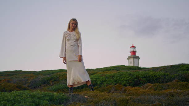 Free Stock Photo of Woman Standing in Front of Lighthouse Painting ...