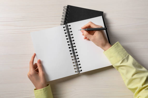 Free Stock Photo of Over the head view of a hand writing on white ...
