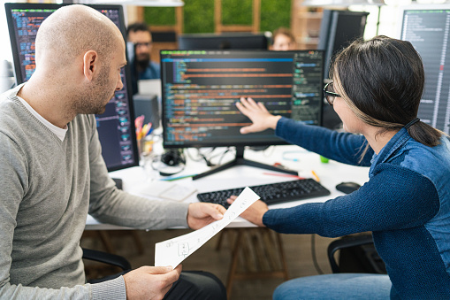 Software Programmers Analyzing Html Code And Database Brainstorming Script Ideas To Develop New