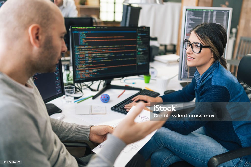Software Programmers Analyzing Html Code And Database Brainstorming Script Ideas To Develop New