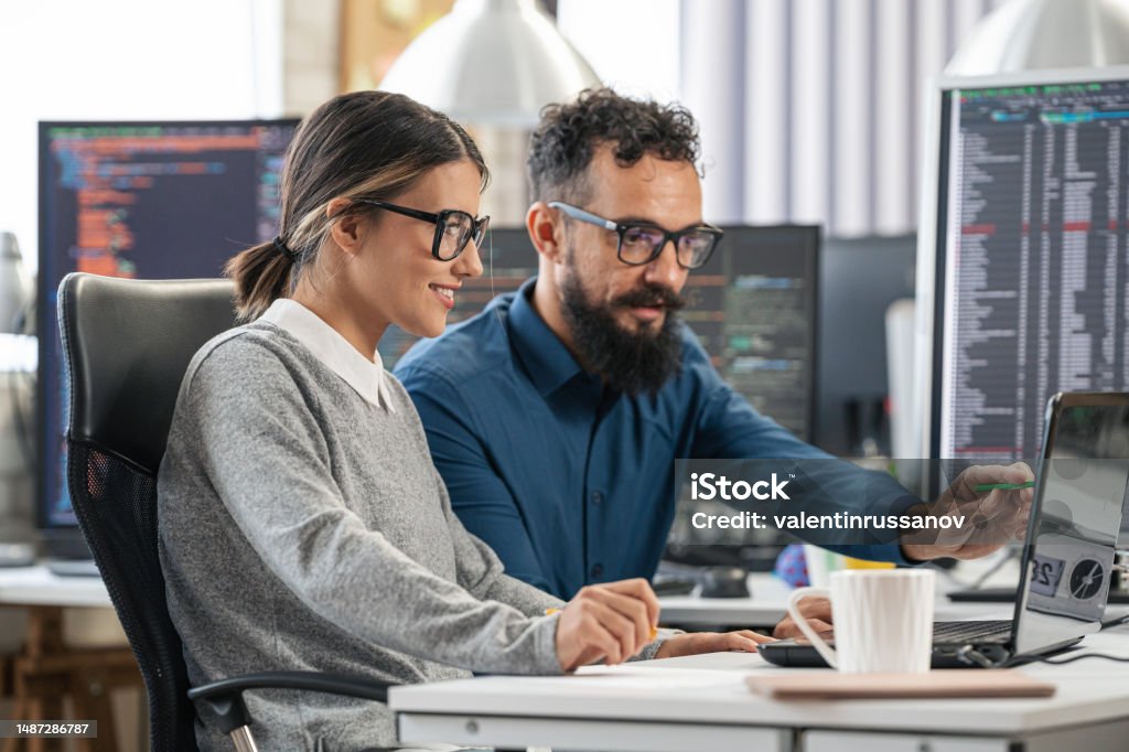 Software Programmers Analyzing Html Code And Database Brainstorming Script Ideas To Develop New