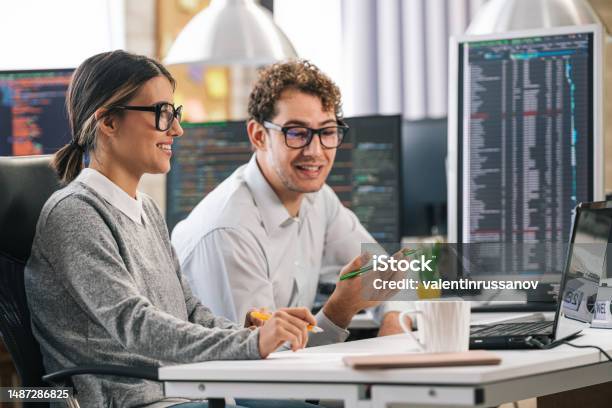 Software Programmers Analyzing Html Code And Database Brainstorming
