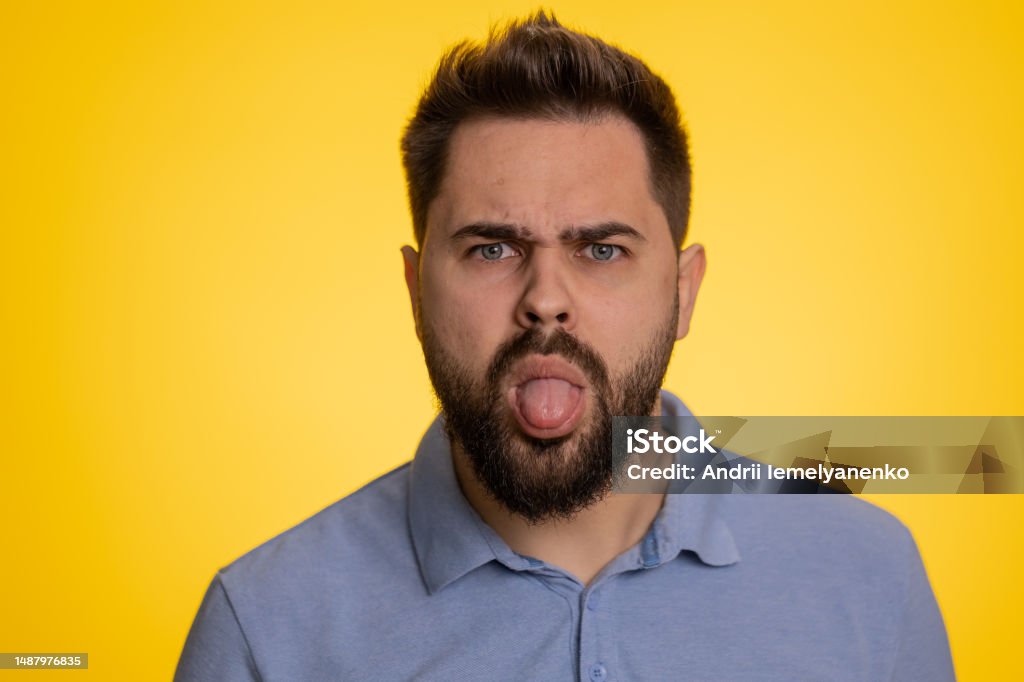 Cheerful Funny Bully Caucasian Man Showing Tongue Making Silly Faces