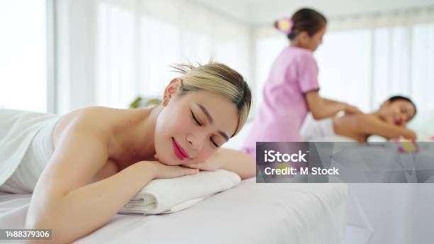 Close Up Face Of Relaxed Young Asian Woman Lying On Spa Bed Closed Eyes