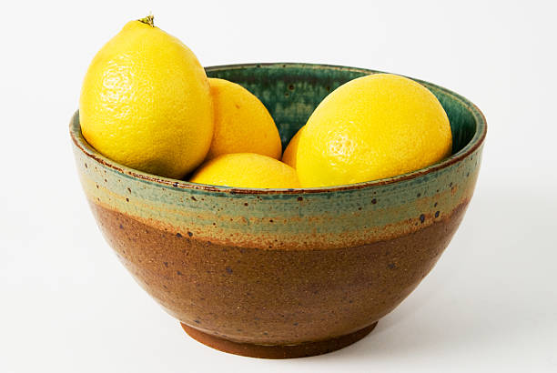 Free Stock Photo of Two lemons resting in a pottery bowl | Download ...