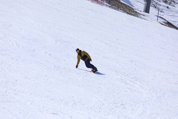 Free Stock Photo of Man Snowboarding Down Snow-Covered Slope | Download ...